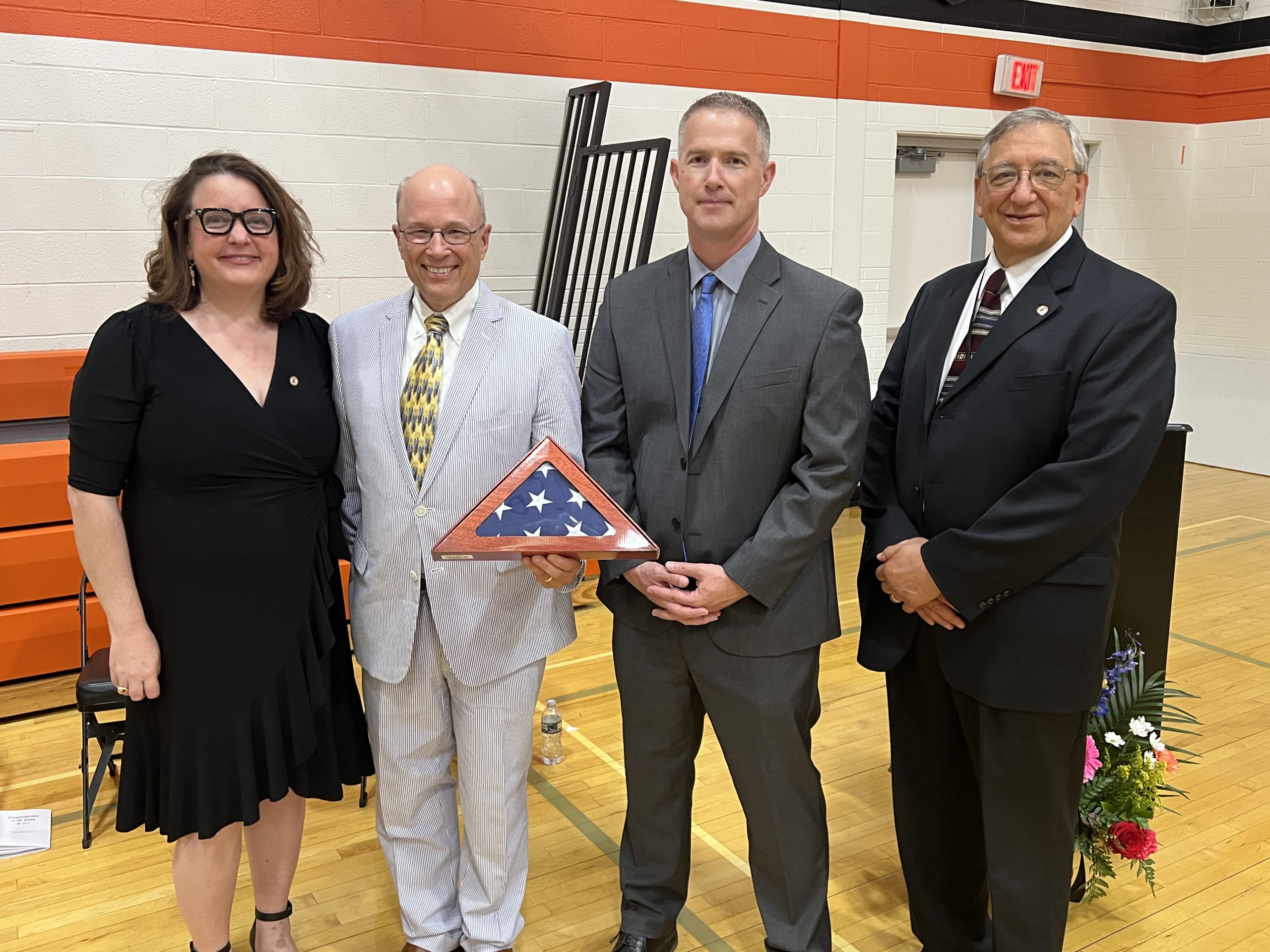 Graduation speaker Robert Kinnin gifts CCS a flag from 3 World Trade ...